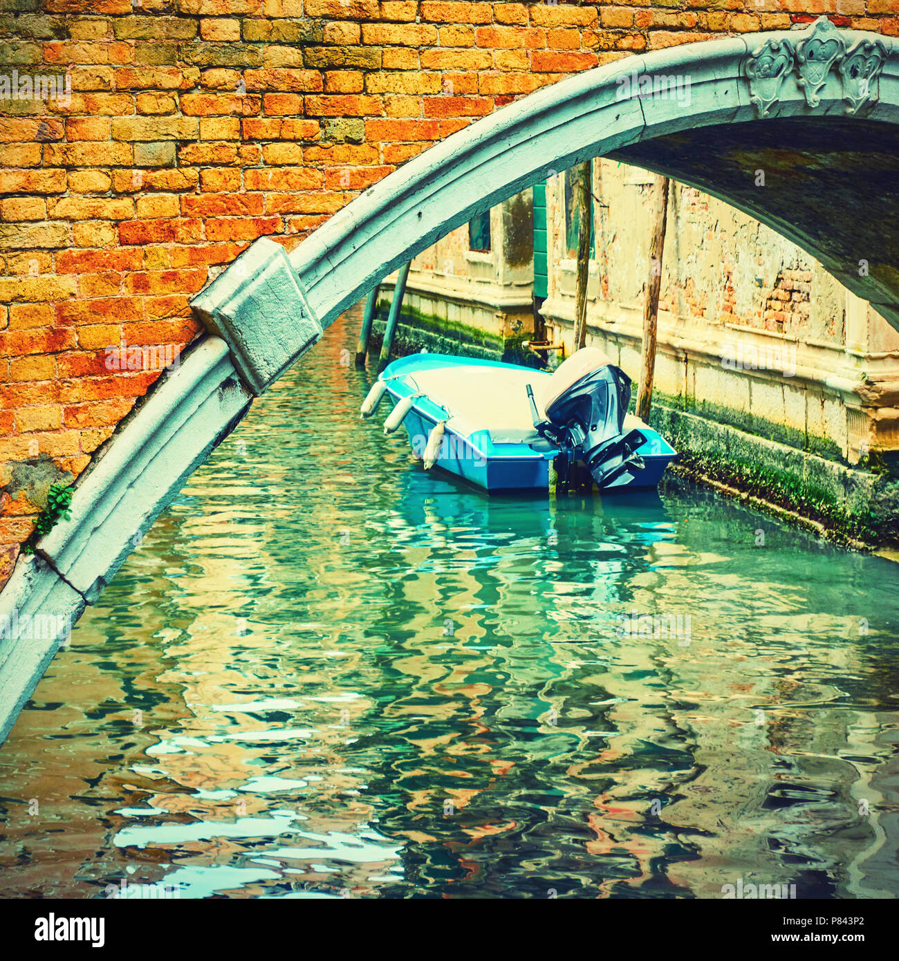 Old small arch bridge over canal in Venice, Italy. Retro style Stock ...