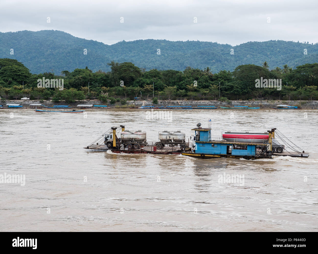 Concrete mixer truck on the ferry boat for crossing the large river ...