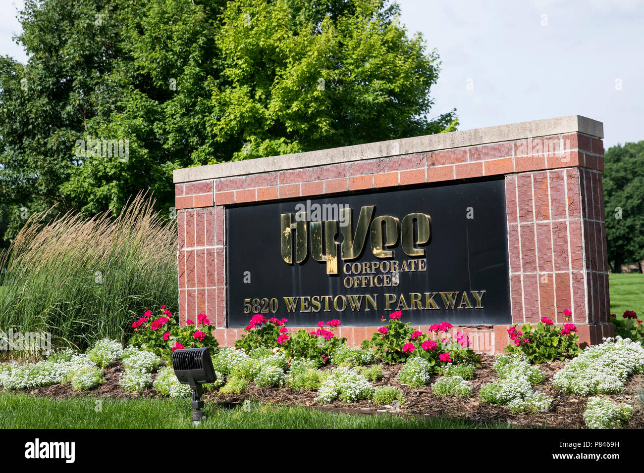 A logo sign outside of the headquarters of Hy-Vee, Inc., in West Des ...