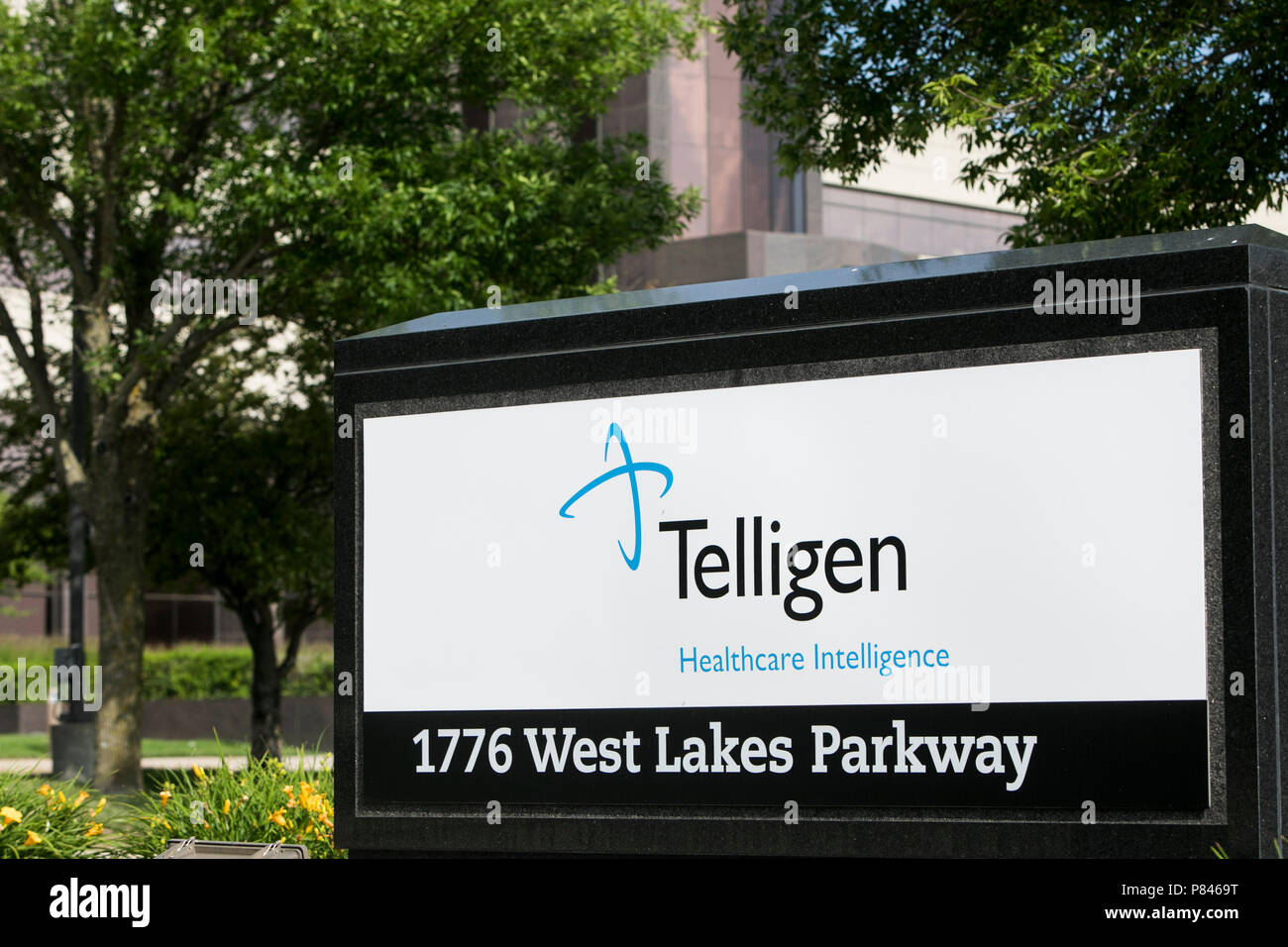 A logo sign outside of the headquarters of Telligen, Inc., in West Des ...