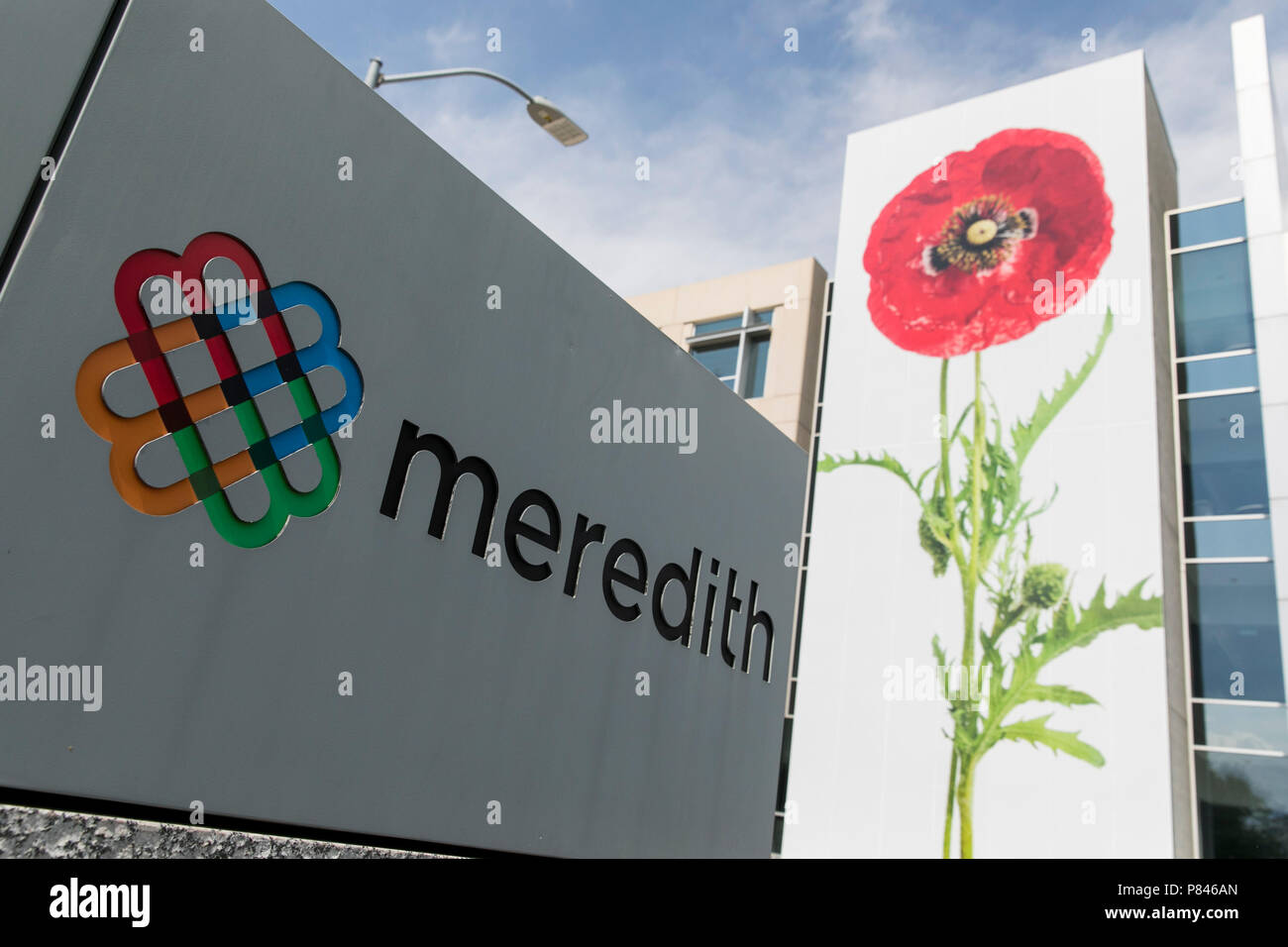 A logo sign outside of the headquarters of the Meredith Corporation in ...