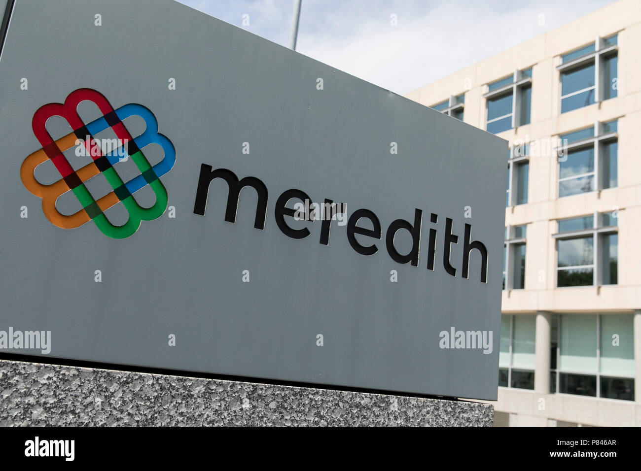A logo sign outside of the headquarters of the Meredith Corporation in ...