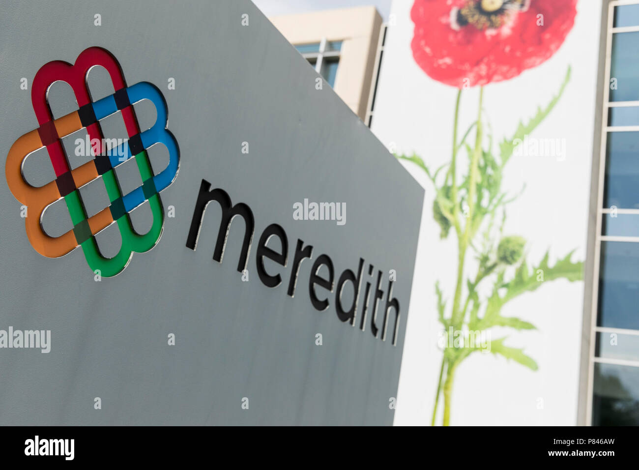 A logo sign outside of the headquarters of the Meredith Corporation in ...