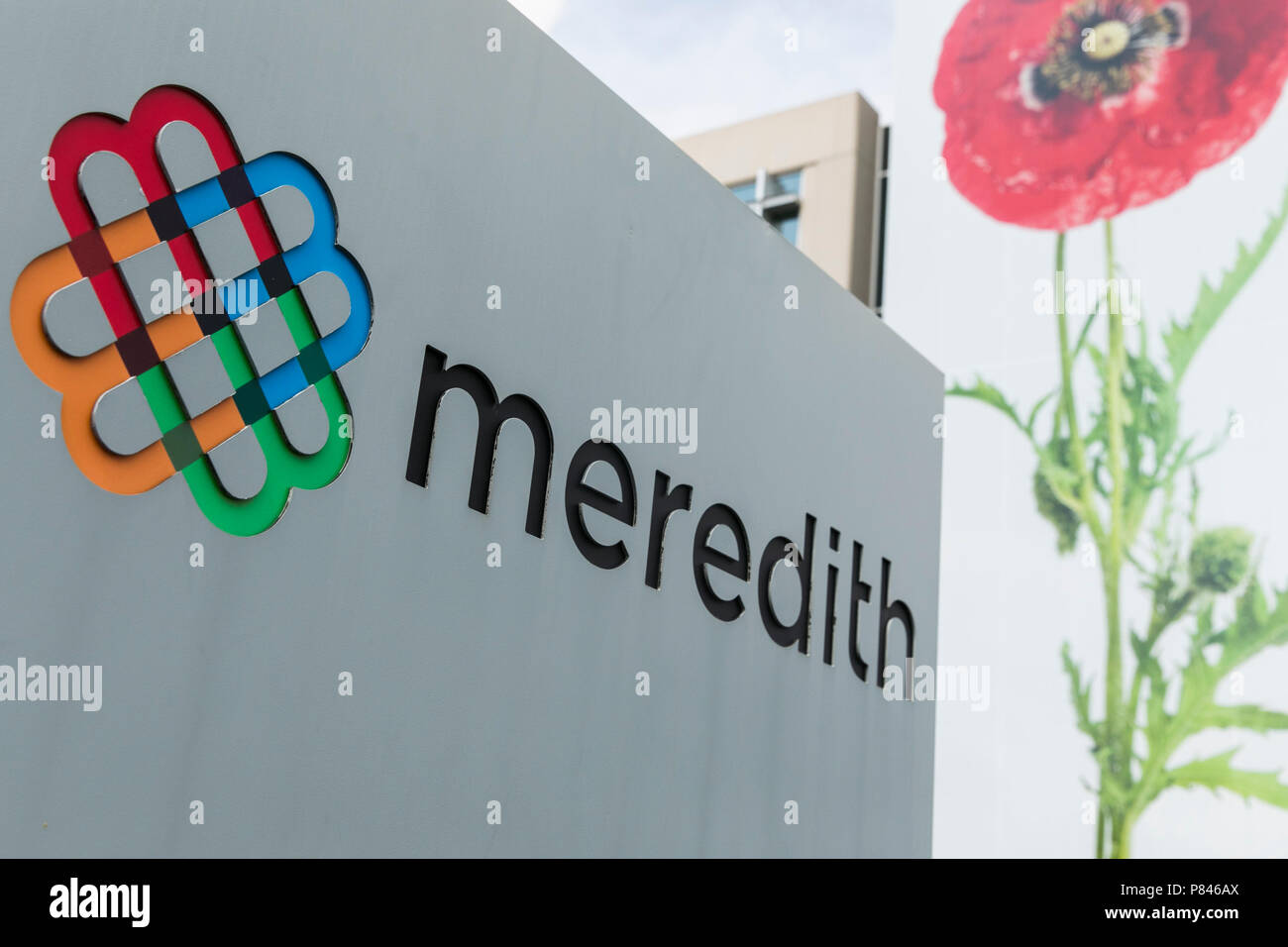 A logo sign outside of the headquarters of the Meredith Corporation in ...