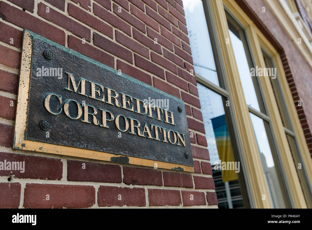 A logo sign outside of the headquarters of the Meredith Corporation in ...