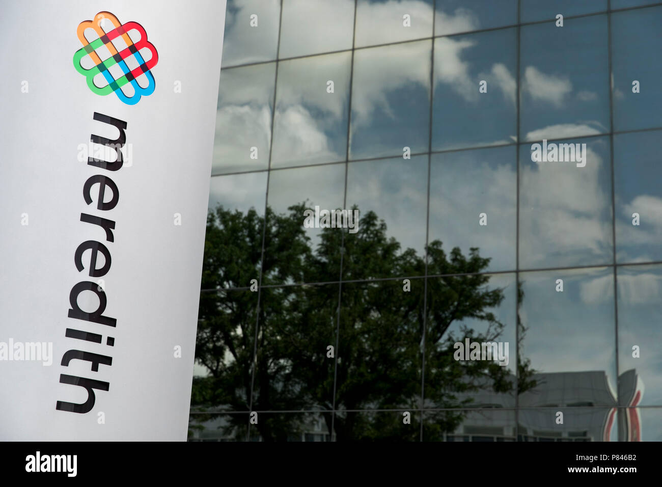 A logo sign outside of the headquarters of the Meredith Corporation in ...