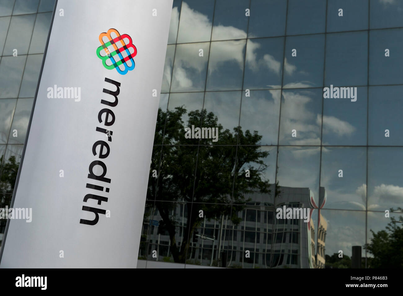 A logo sign outside of the headquarters of the Meredith Corporation in ...