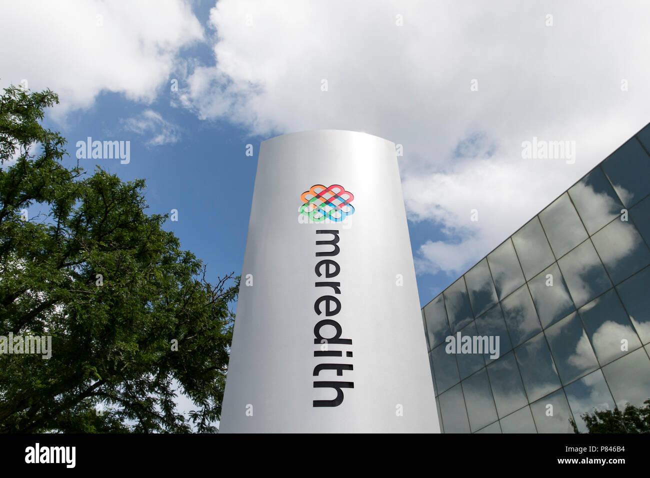 A logo sign outside of the headquarters of the Meredith Corporation in ...