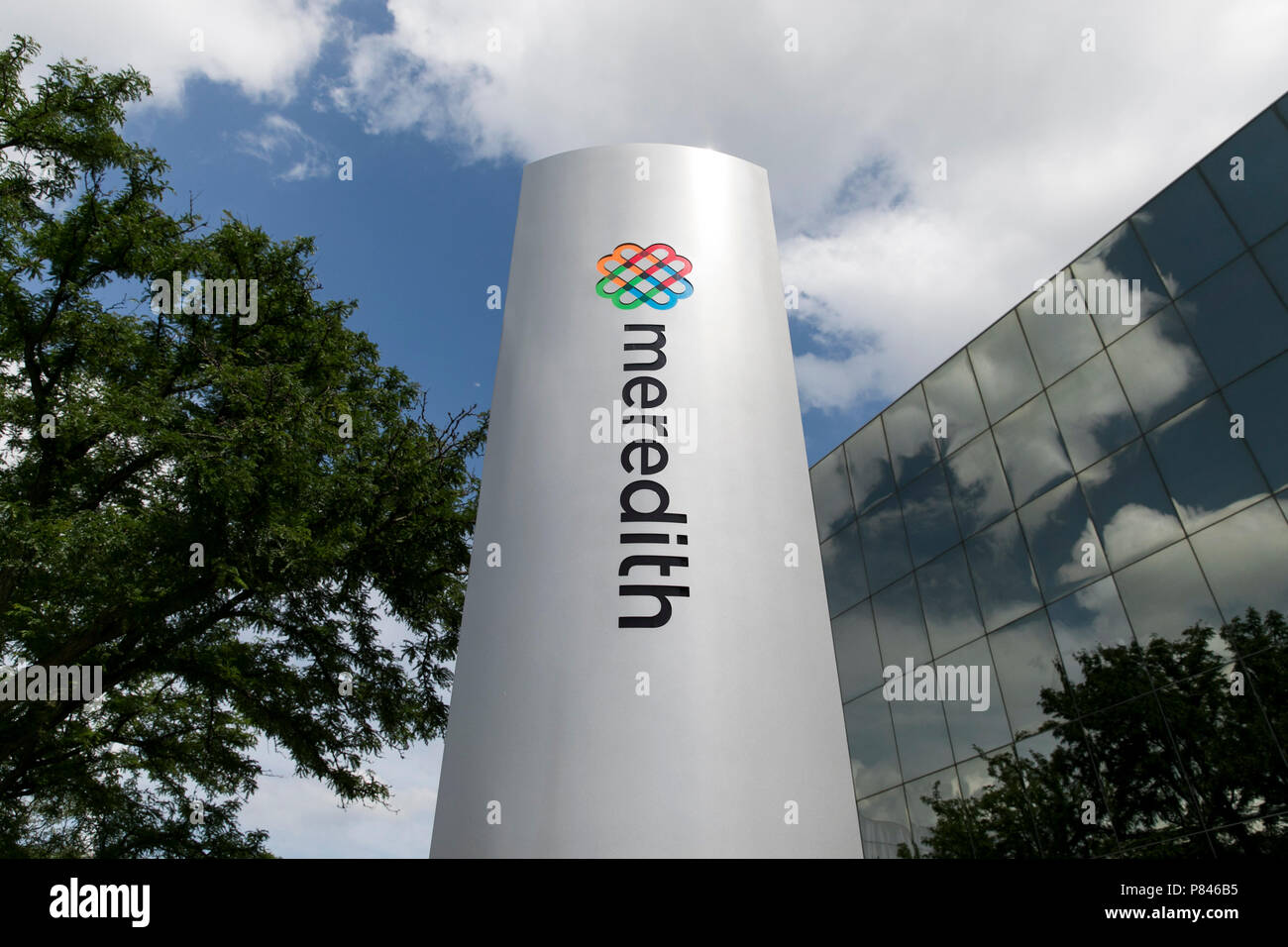 A logo sign outside of the headquarters of the Meredith Corporation in ...