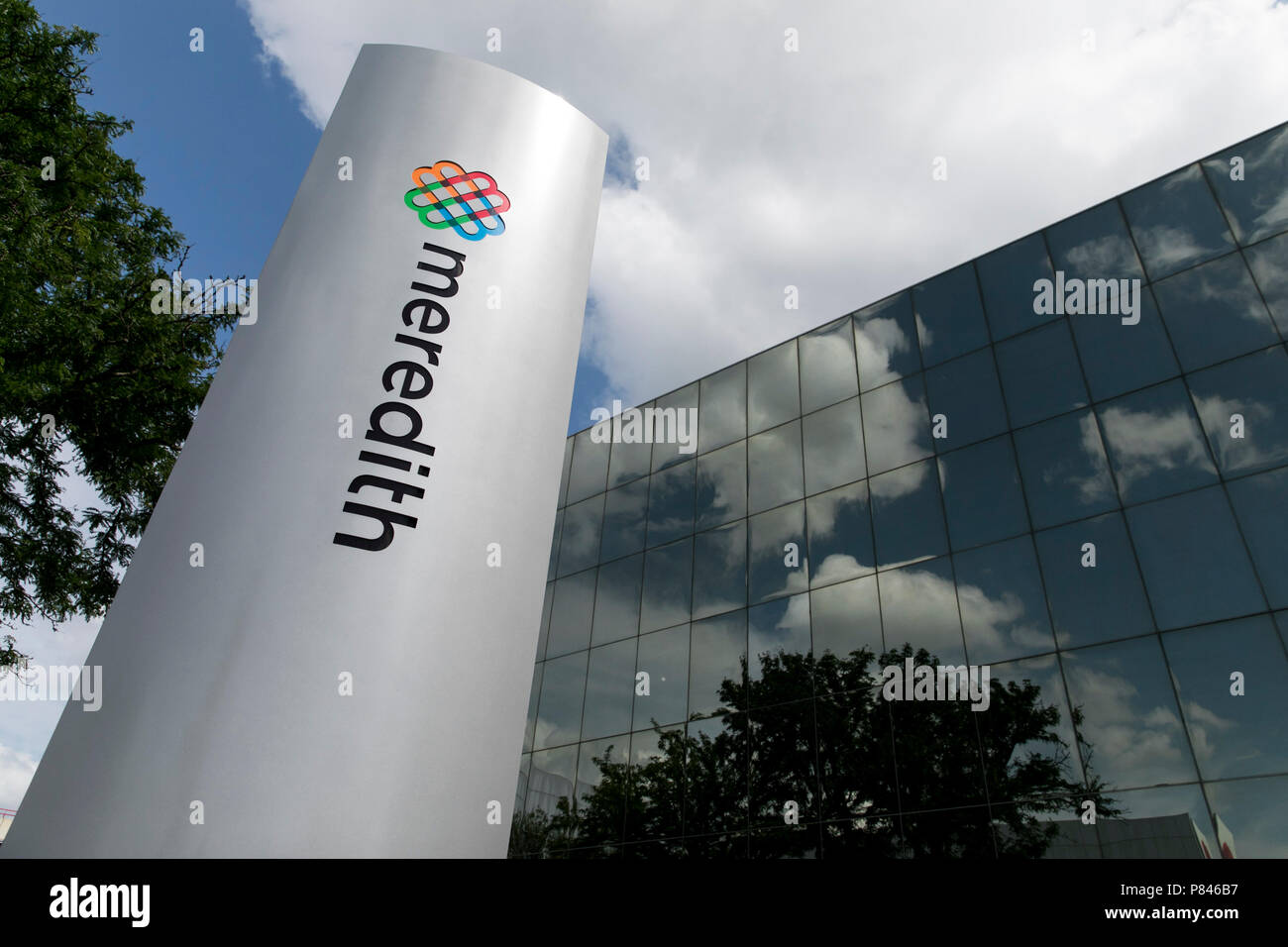 A logo sign outside of the headquarters of the Meredith Corporation in ...