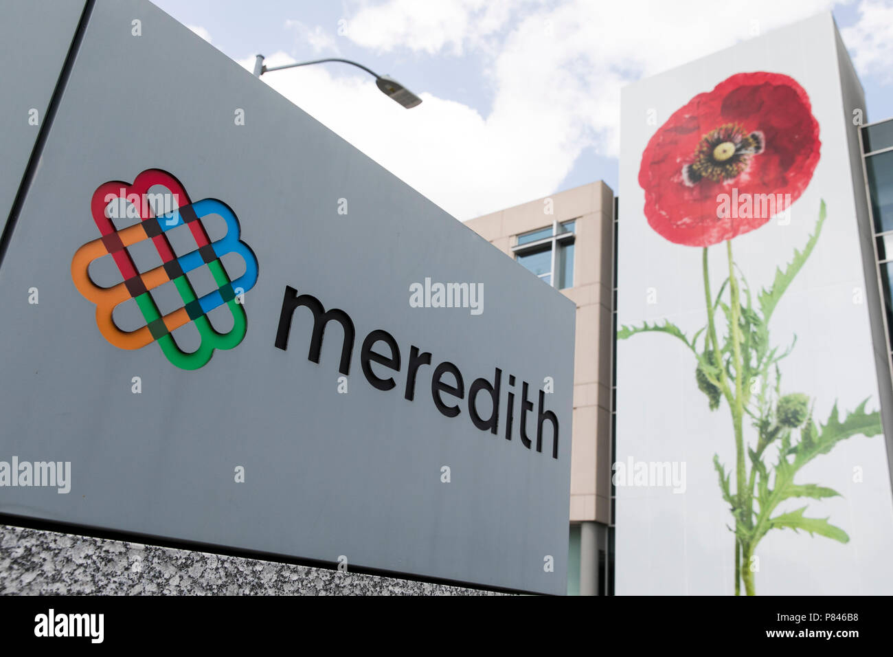 A logo sign outside of the headquarters of the Meredith Corporation in ...