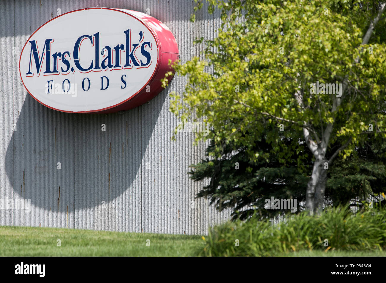 A logo sign outside of a facility occupied by Mrs. Clark's Foods in ...