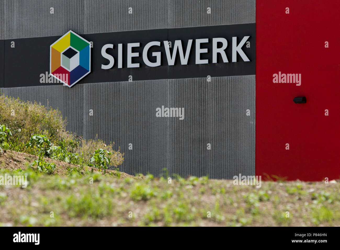 A logo sign outside of a facility occupied by Siegwerk in Des Moines ...