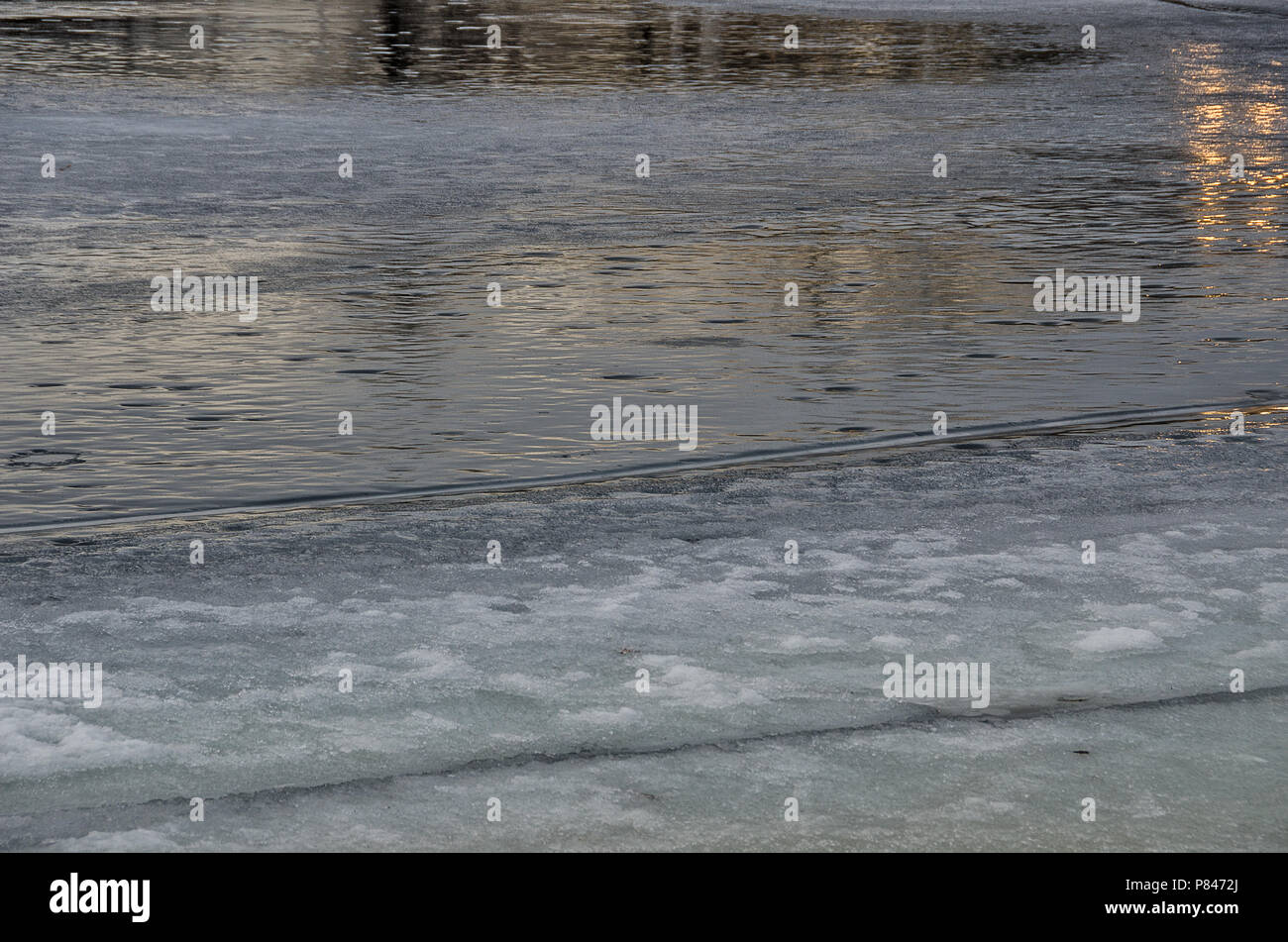 Water in various stages from water to ice to slush with pretty ...