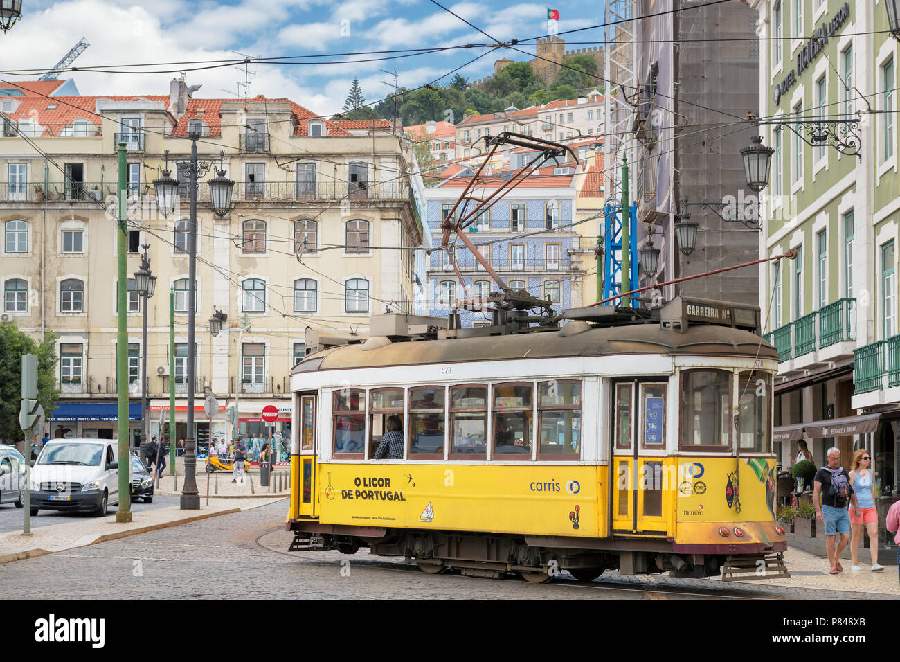Yellow tram in the city center of Lisbon, Portugal Stock Photo - Alamy