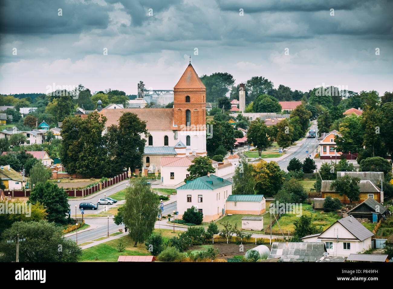 Mir, Belarus. Landscape Of Village Houses And Saint Nicolas Roman ...
