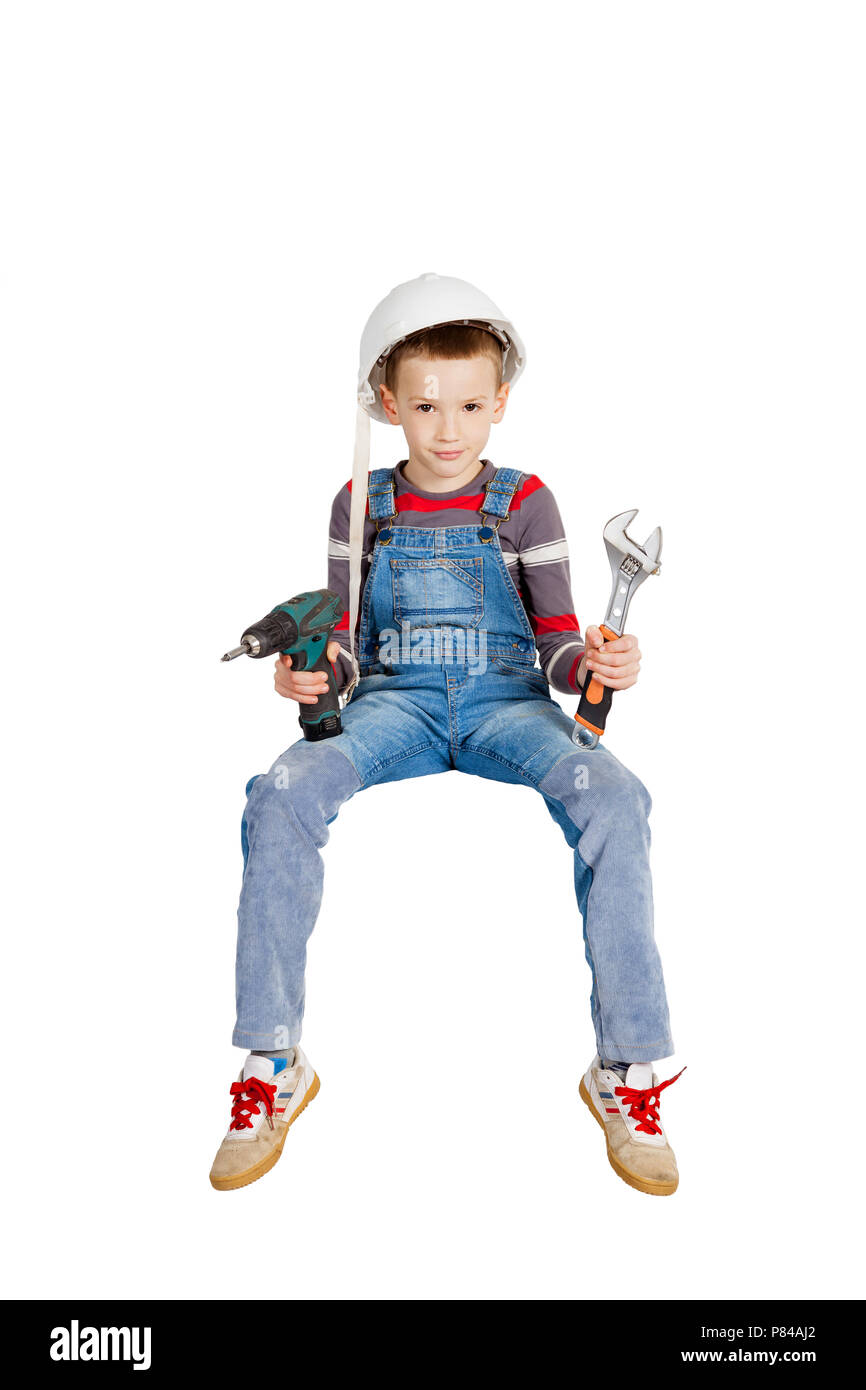 Boy builder helper in helmet Stock Photo - Alamy