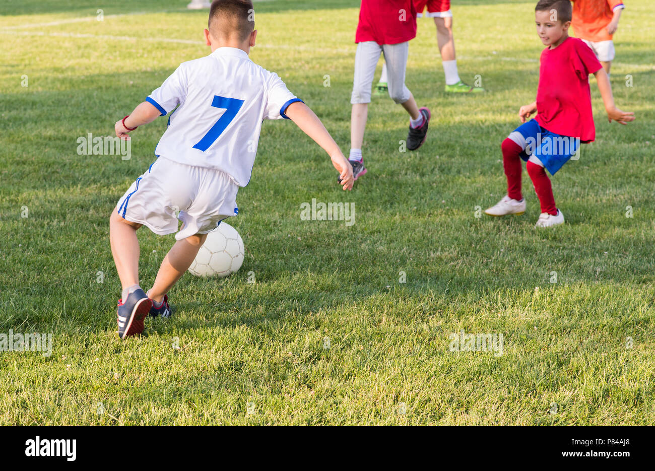 Kids soccer football - young children players match on soccer field ...