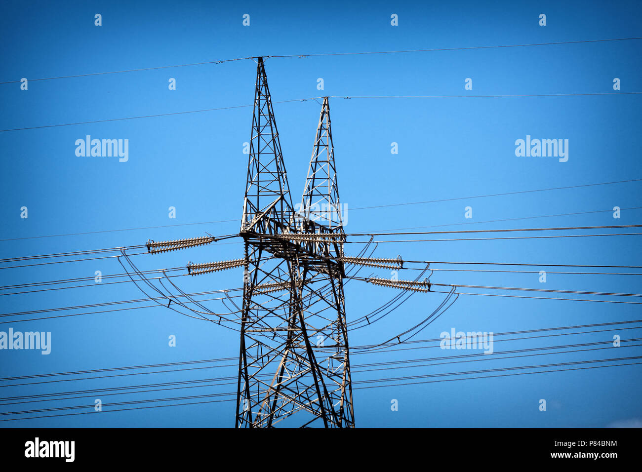an image of a metal tower of Power Lines Stock Photo - Alamy