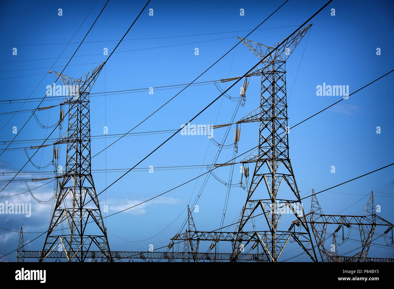 an image of a metal tower of Power Lines Stock Photo - Alamy