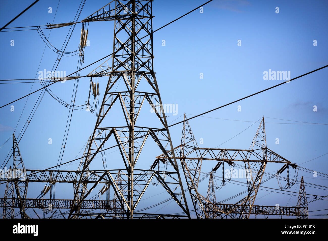 an image of a metal tower of Power Lines Stock Photo - Alamy