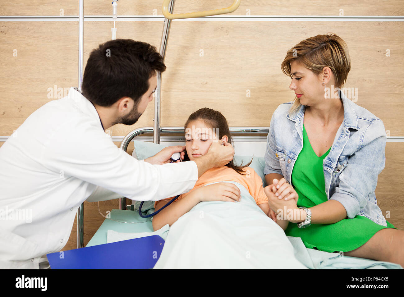 Doctor checking her patient heart in hospital Stock Photo - Alamy