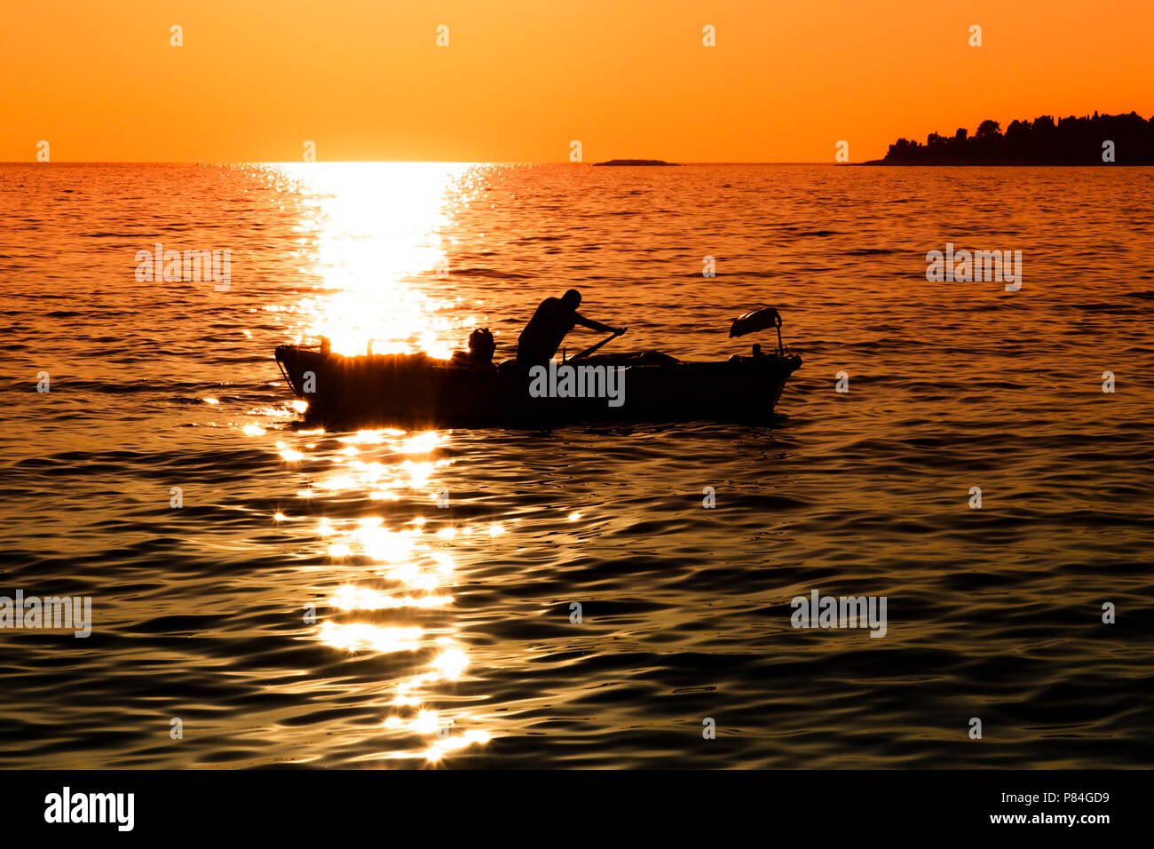 Man boat in sea sunset sky boat hi-res stock photography and images - Alamy