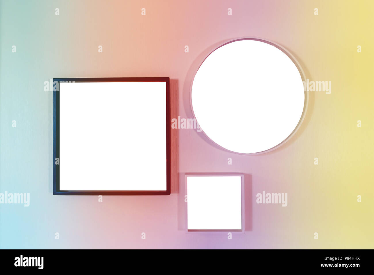 Square and round frame for photo on a white wall. blank template frame ...