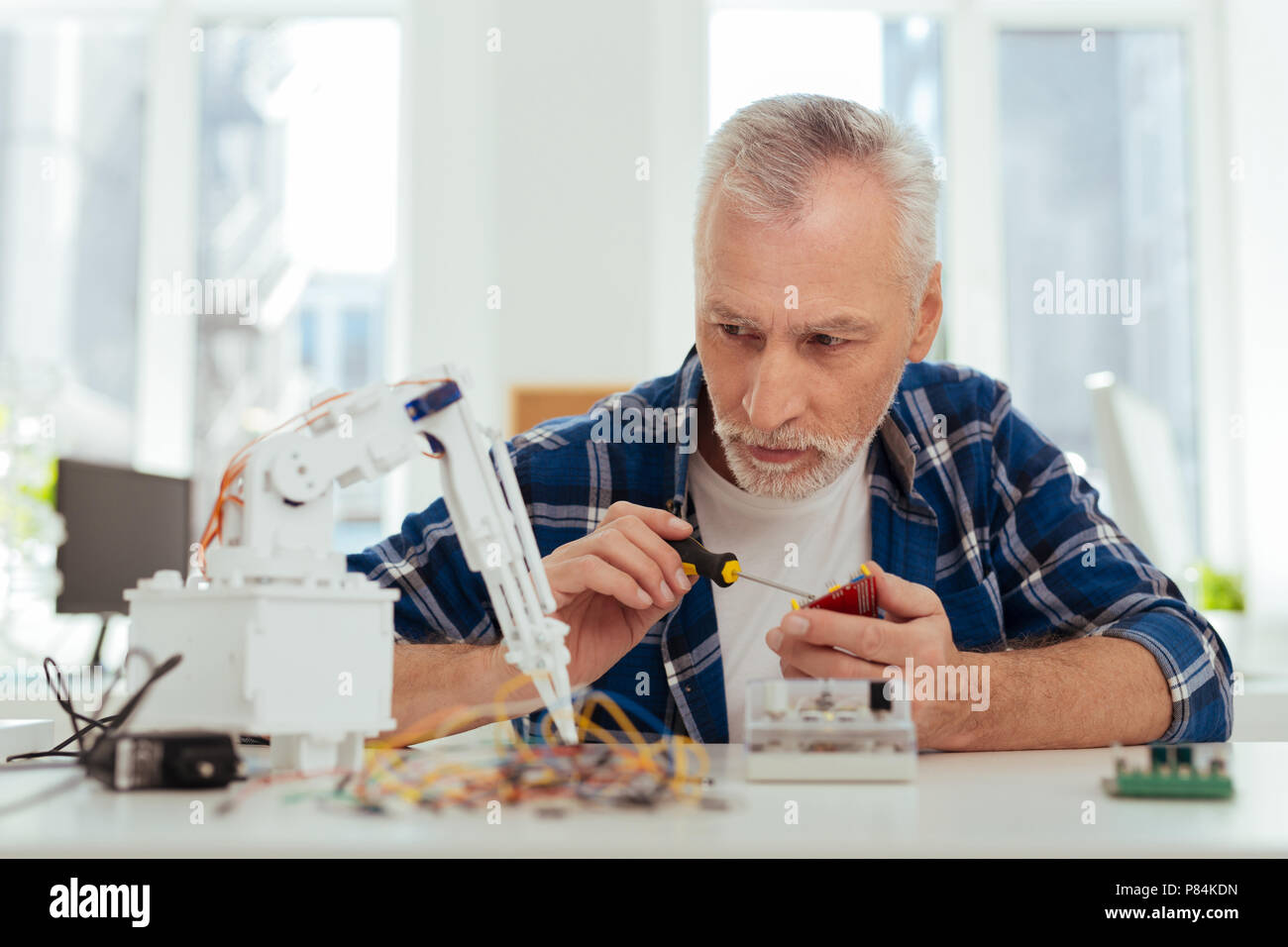 Serious smart engineer working Stock Photo - Alamy