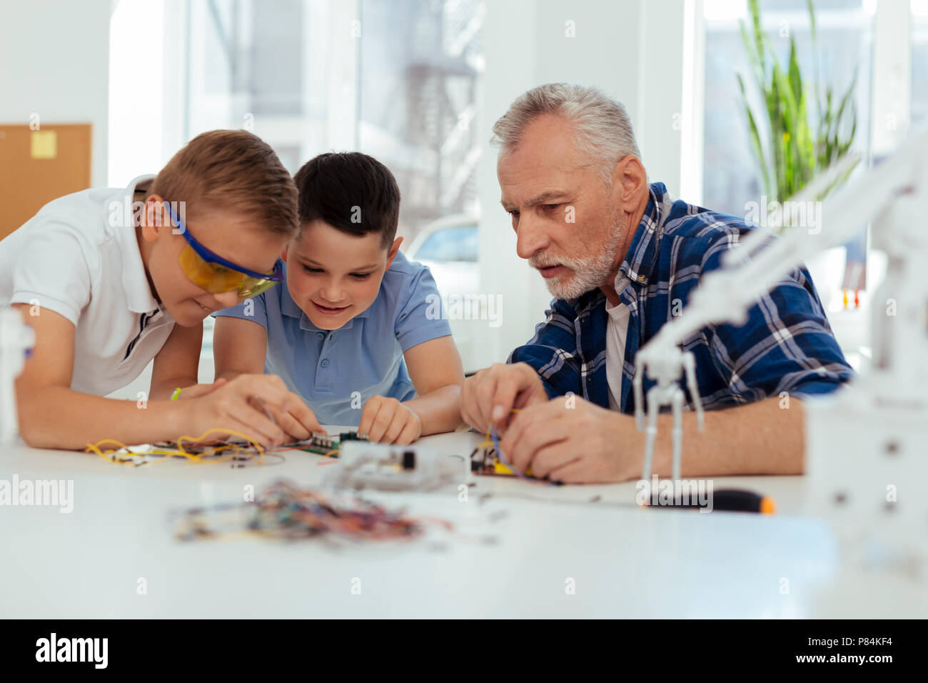 Nice smart boys working together Stock Photo - Alamy