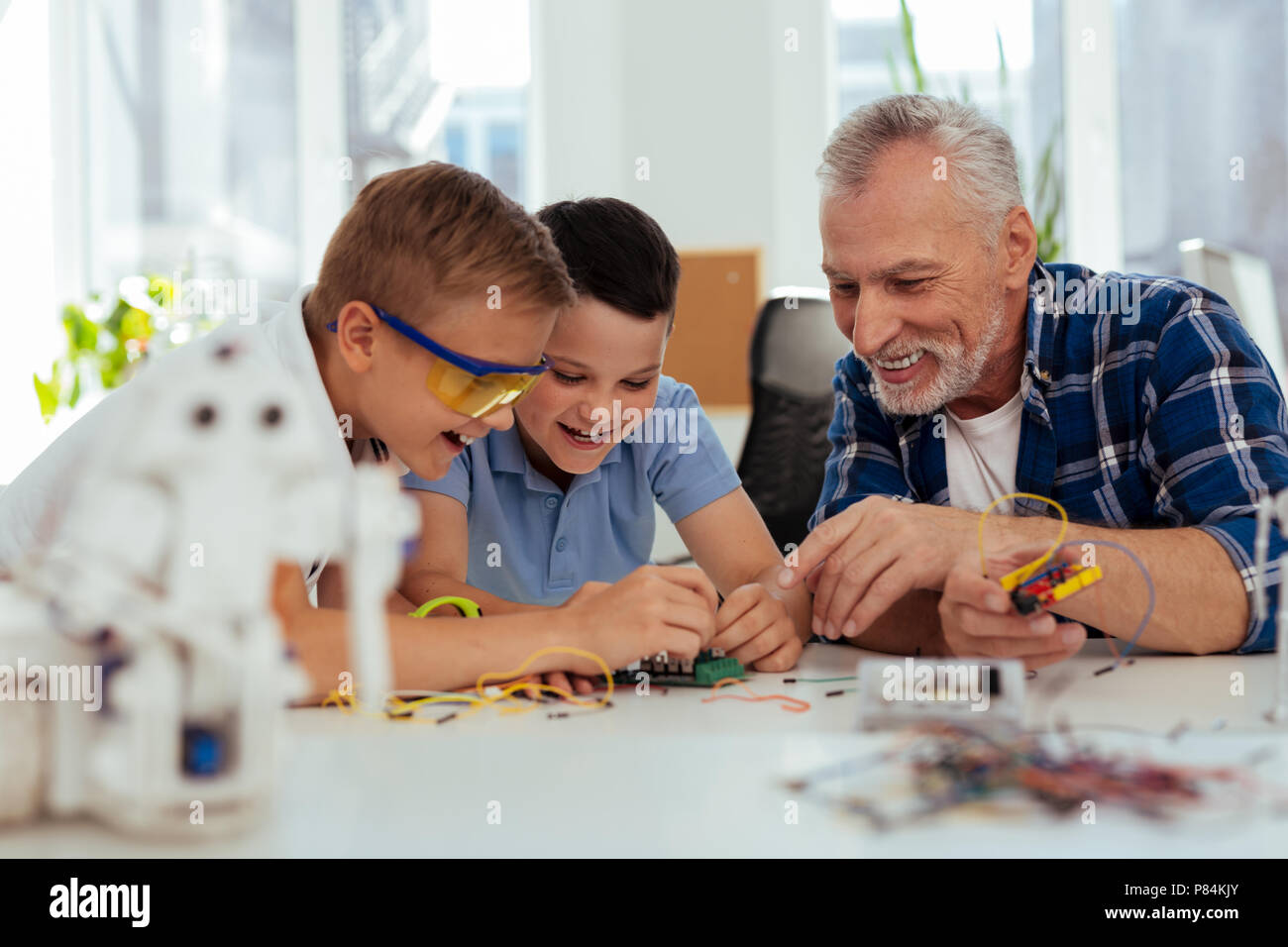 Nice smart boys having a science lesson Stock Photo - Alamy