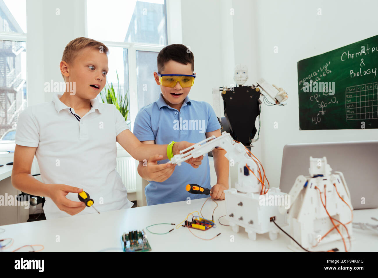 Boys working on project together hi-res stock photography and images ...