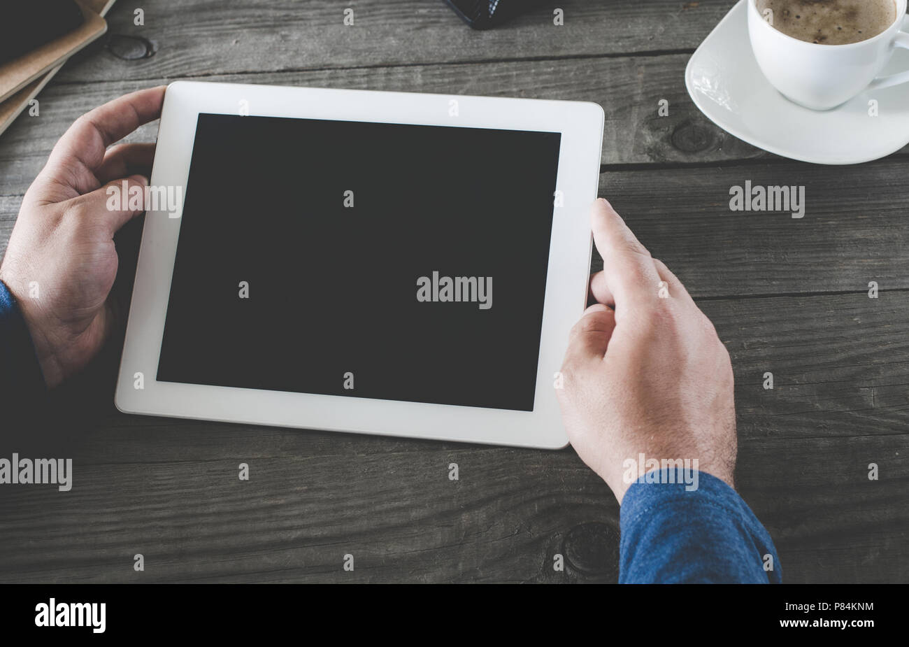 Tablet computer with blank screen for your text message in men hands ...