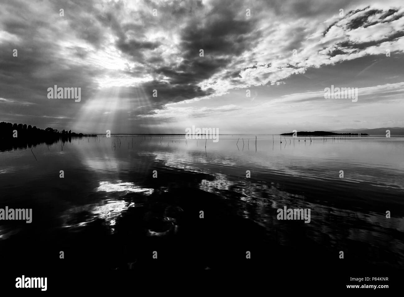Perfectly symmetric and spectacular view of a lake, with clouds, sky ...