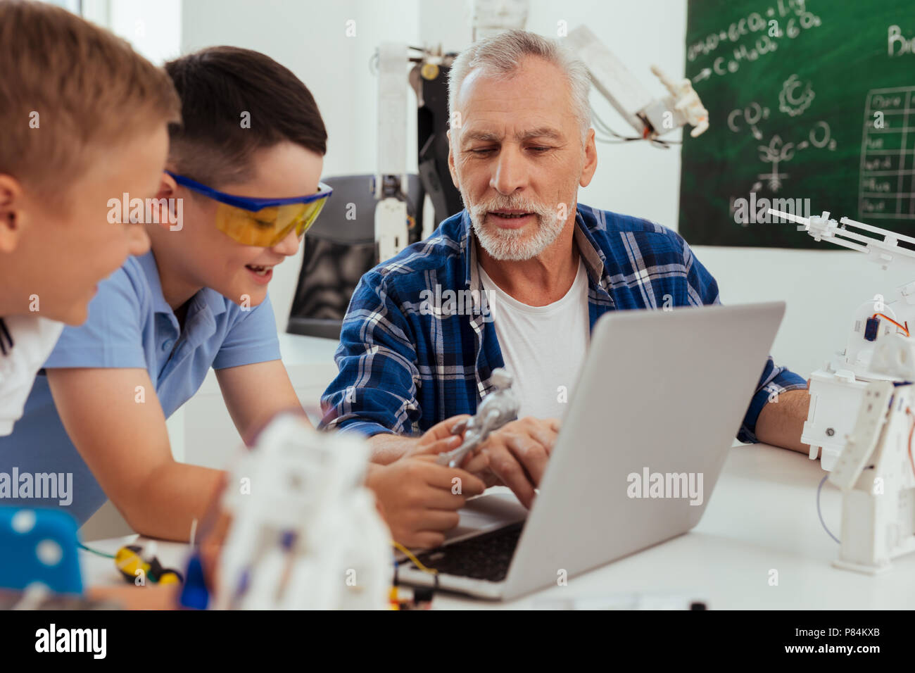 Happy cheerful boy using a laptop Stock Photo - Alamy
