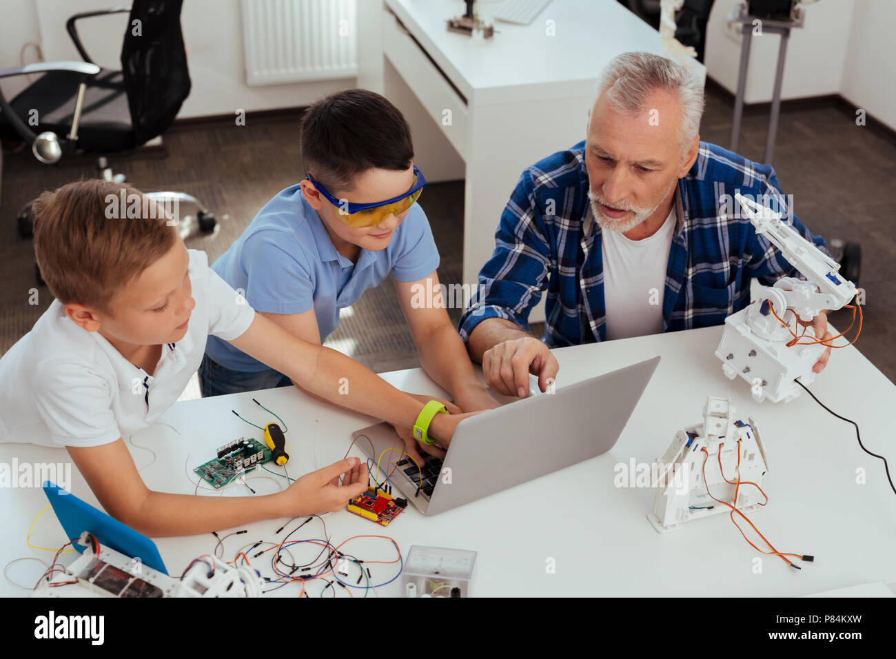 Nice joyful people pointing at the laptop screen Stock Photo - Alamy