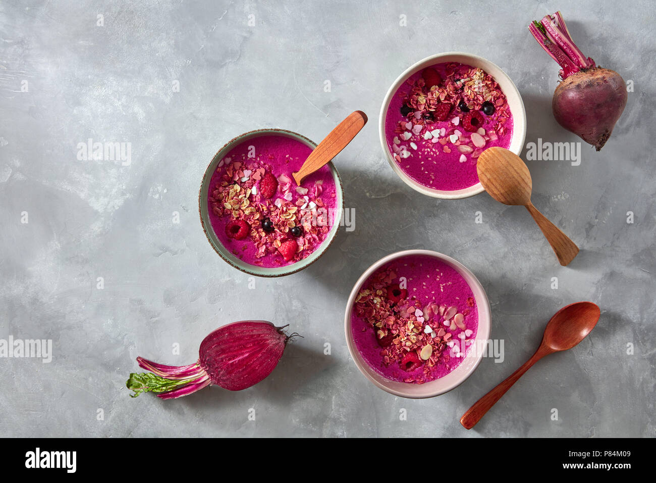 Ceramic handmade bowls with useful red smoothies for breakfast on a ...