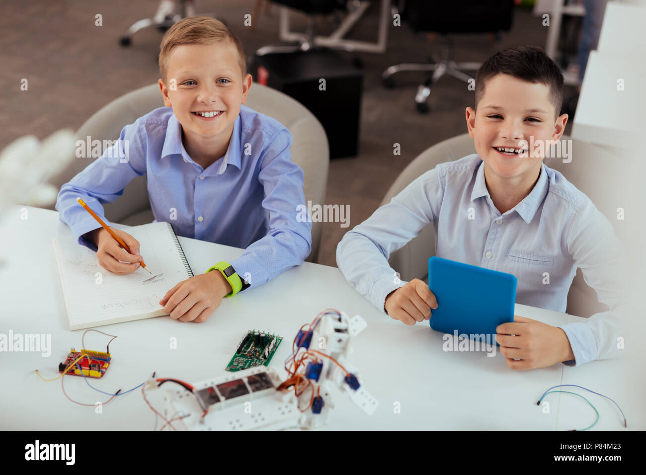Happy positive boys smiling Stock Photo - Alamy