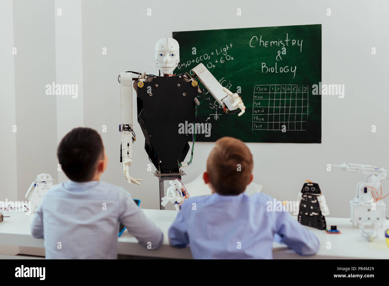 Smart self automated robot looking at the pupils Stock Photo - Alamy