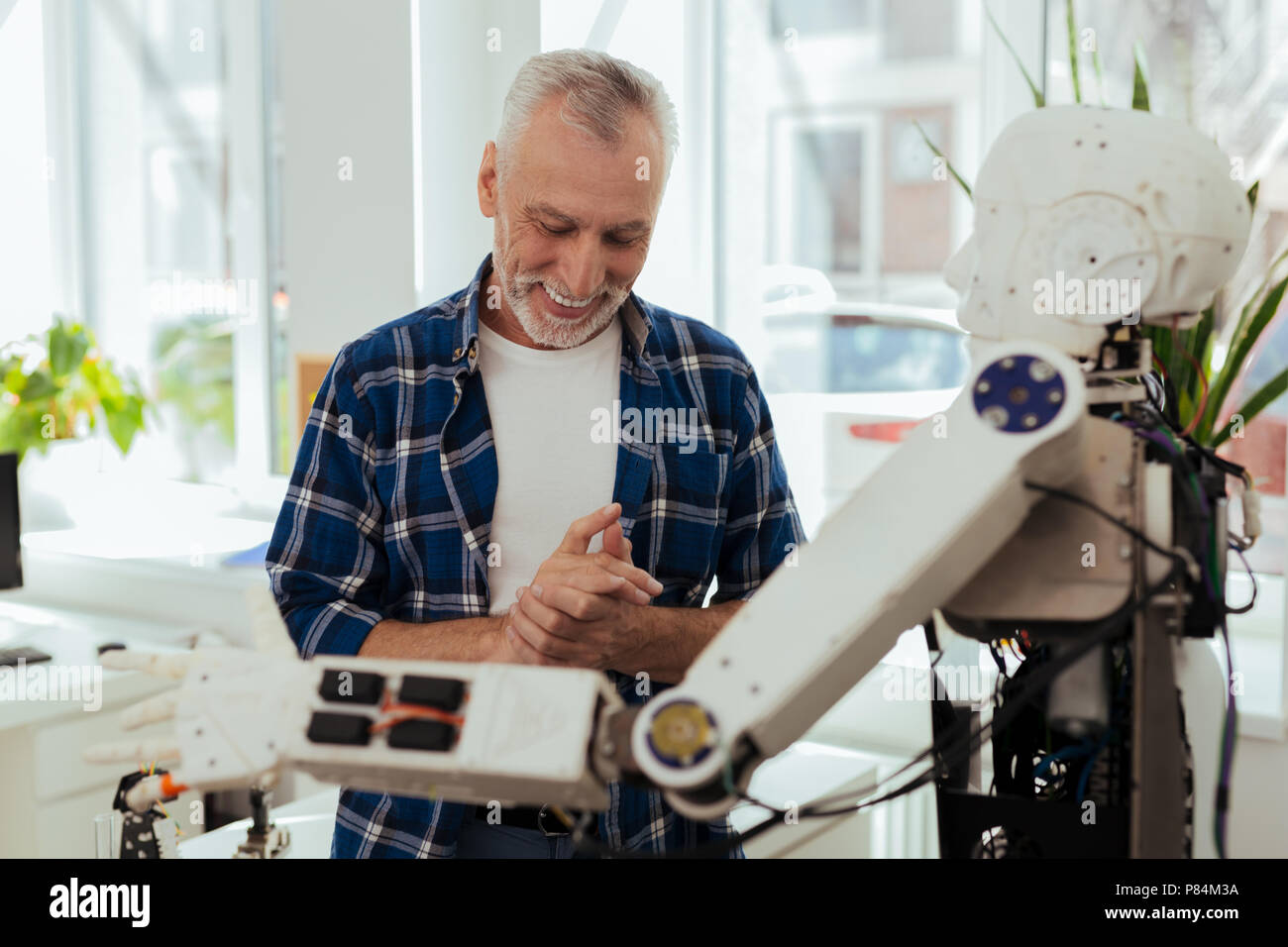 Happy nice man enjoying new technology Stock Photo - Alamy