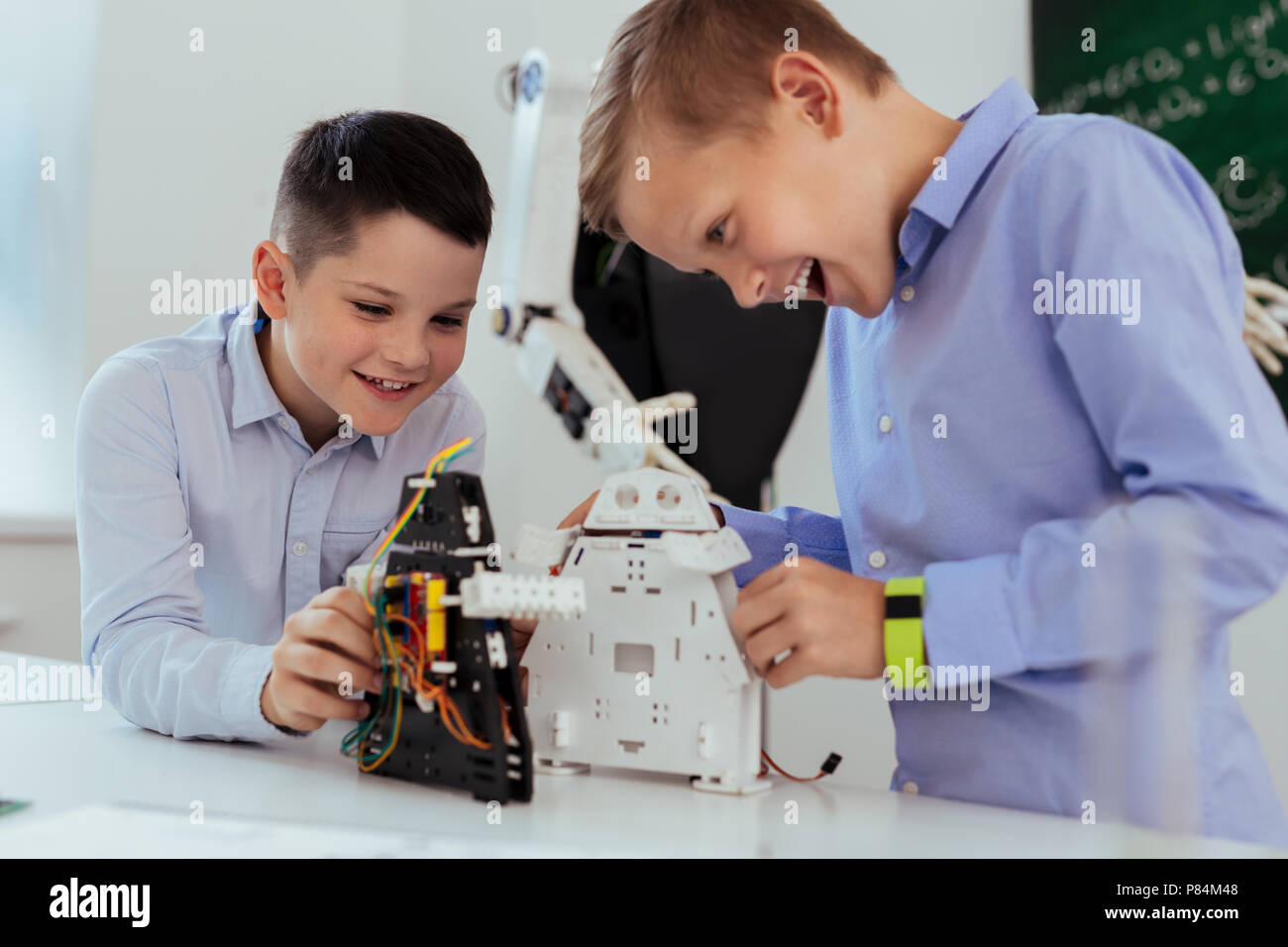 Positive excited boys playing Stock Photo - Alamy