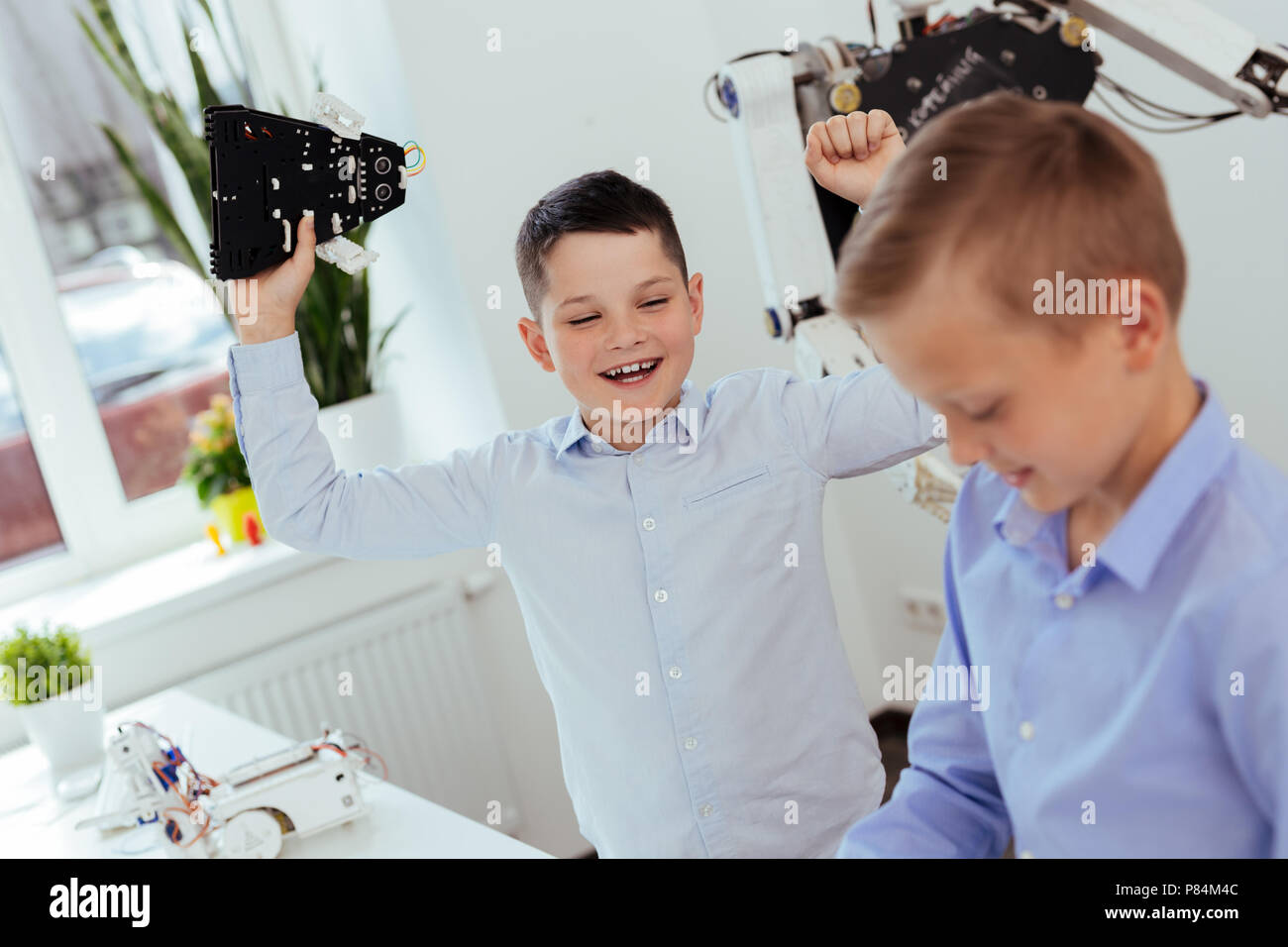 Cheerful delighted boy smiling Stock Photo - Alamy