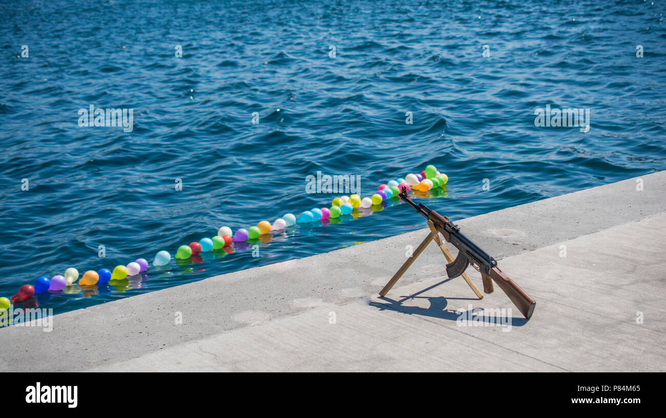 Balloon on a string on water for shooting game Stock Photo - Alamy