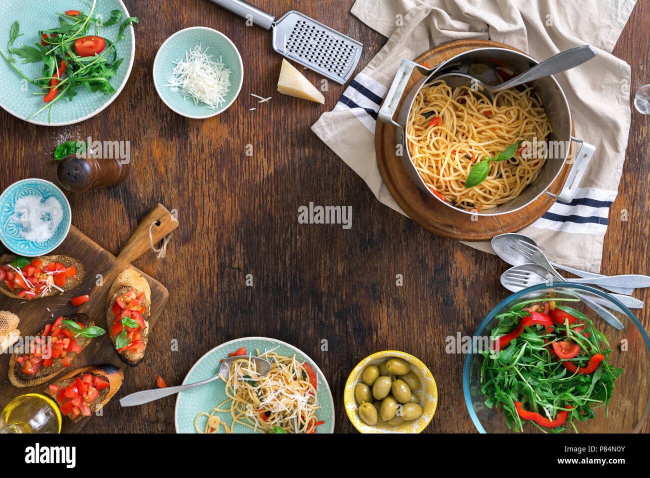 Frame of Italian pasta and snacks on a wooden table. Italian dinner ...