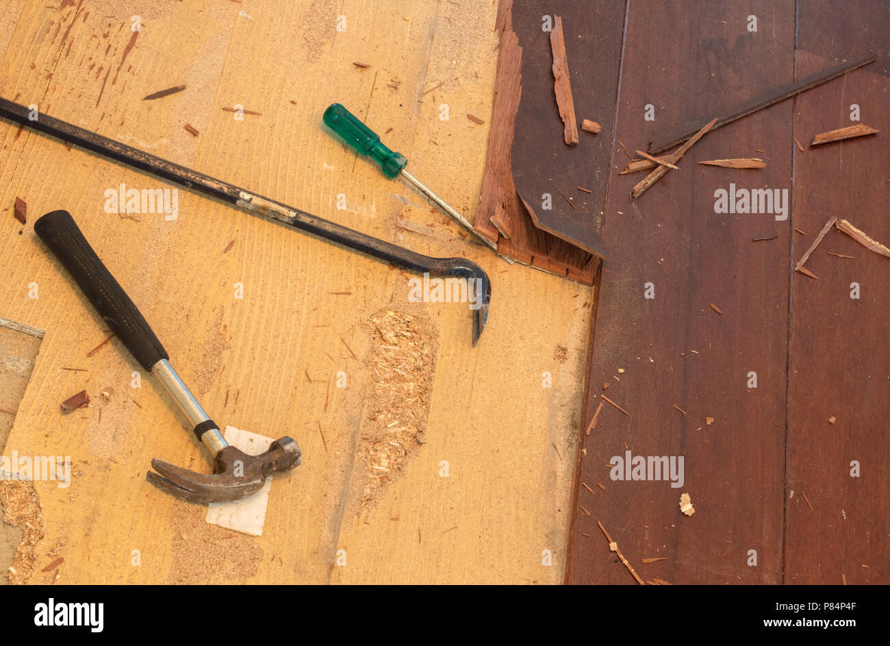 Breaking up a solid wooden floor in a house Stock Photo - Alamy
