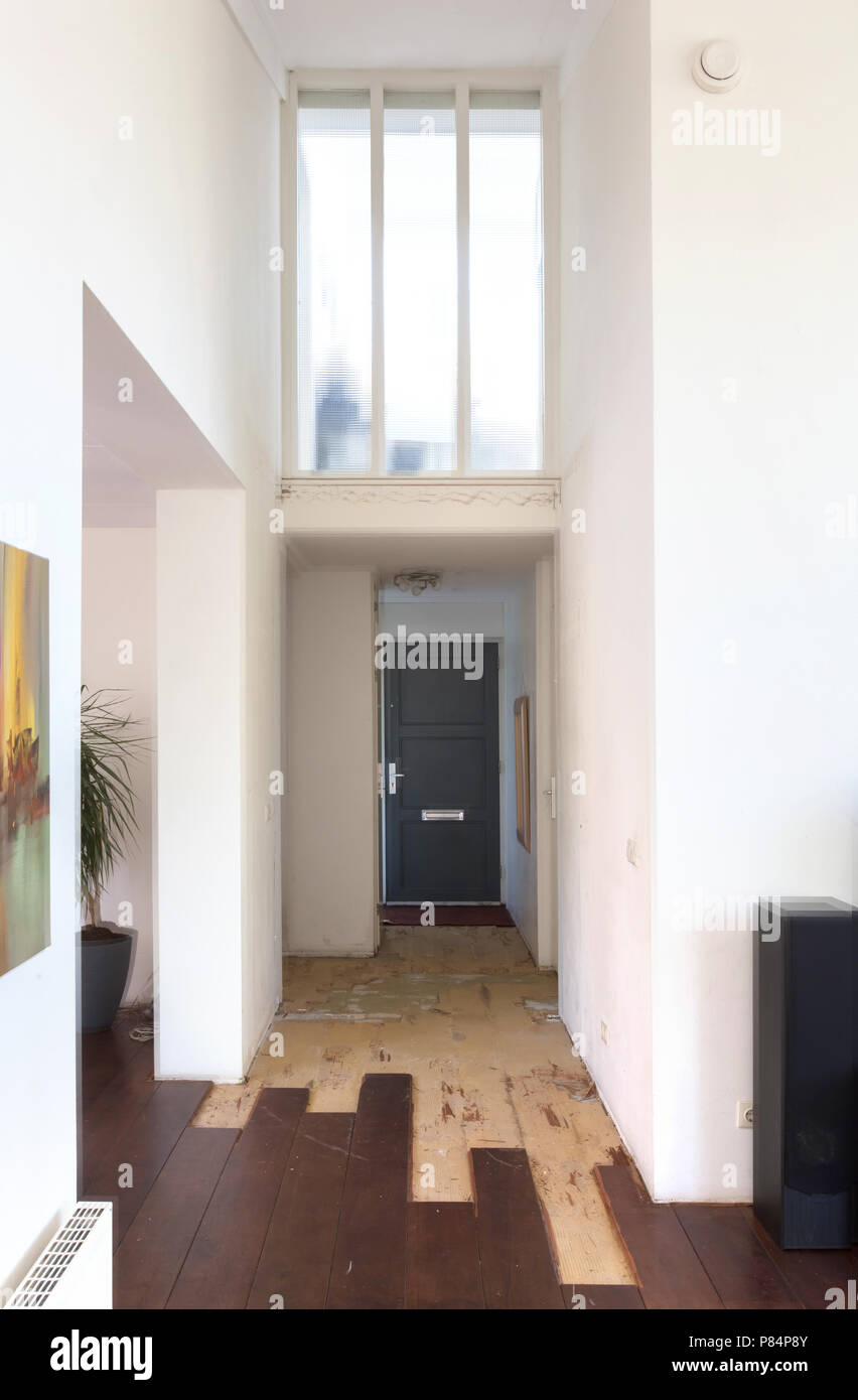 Breaking up a solid wooden floor in a house Stock Photo - Alamy