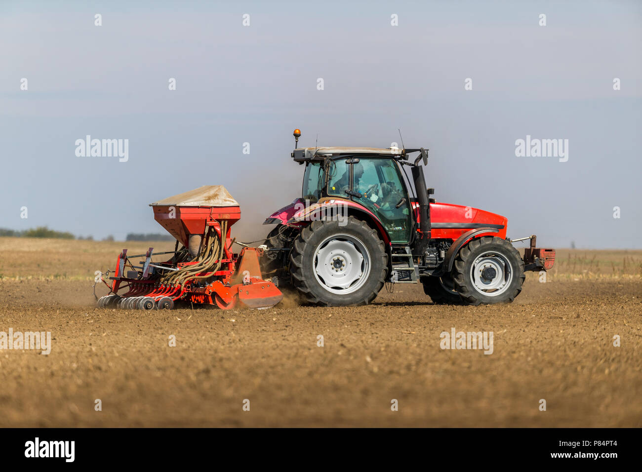 Farmer seeding, sowing crops at field. Sowing is the process of ...
