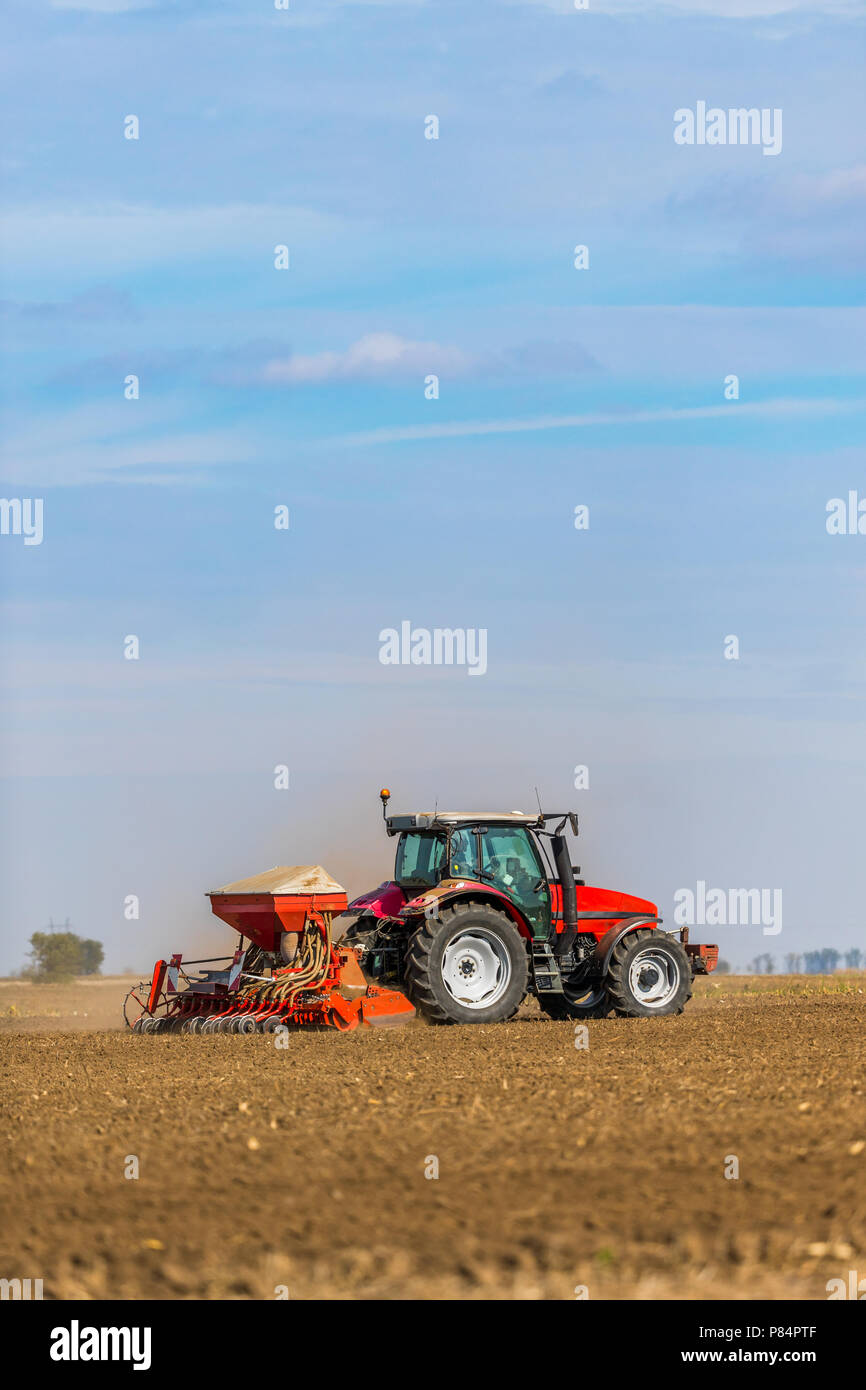 Farmer seeding, sowing crops at field. Sowing is the process of ...