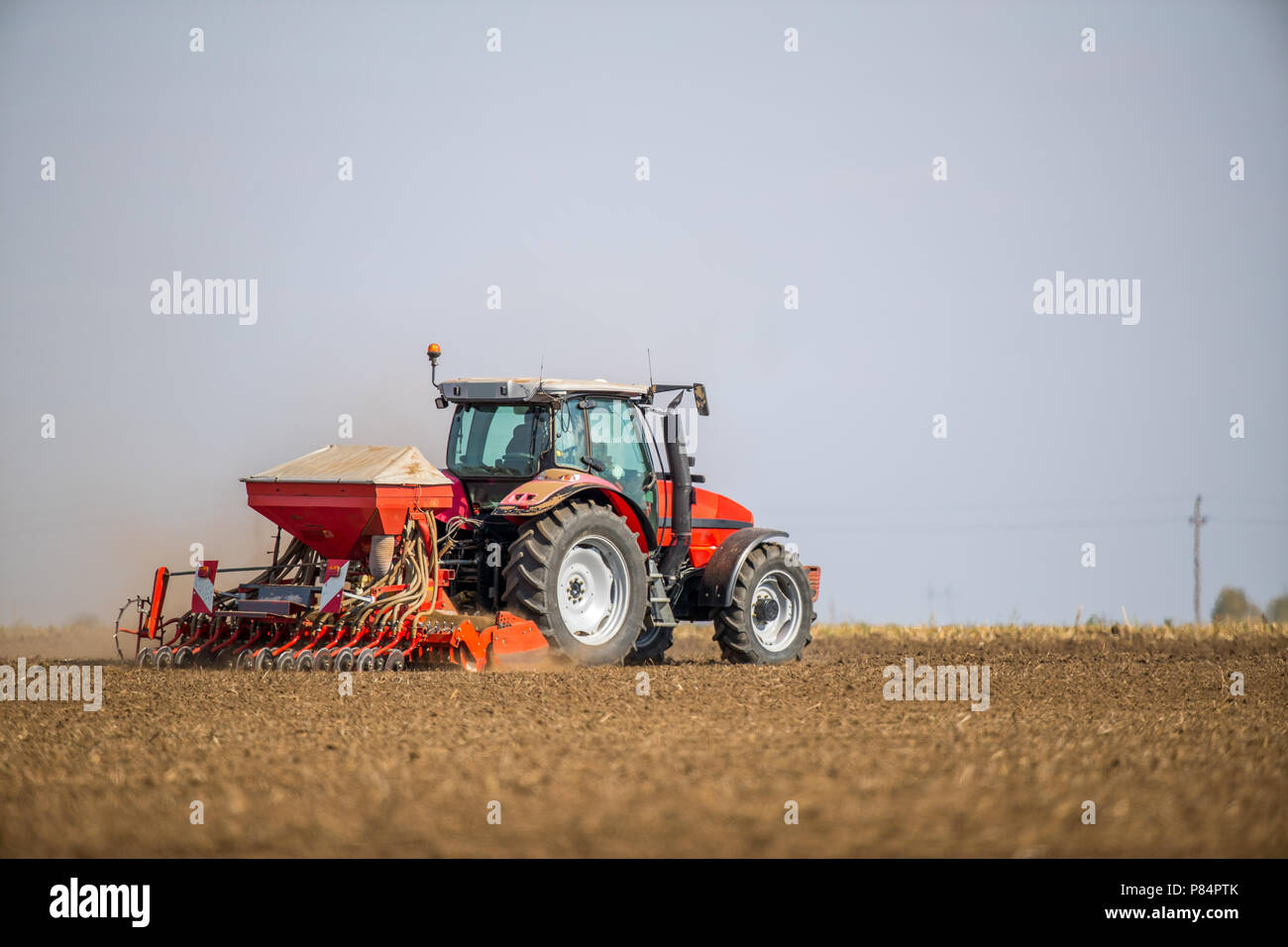 Farmer seeding, sowing crops at field. Sowing is the process of ...
