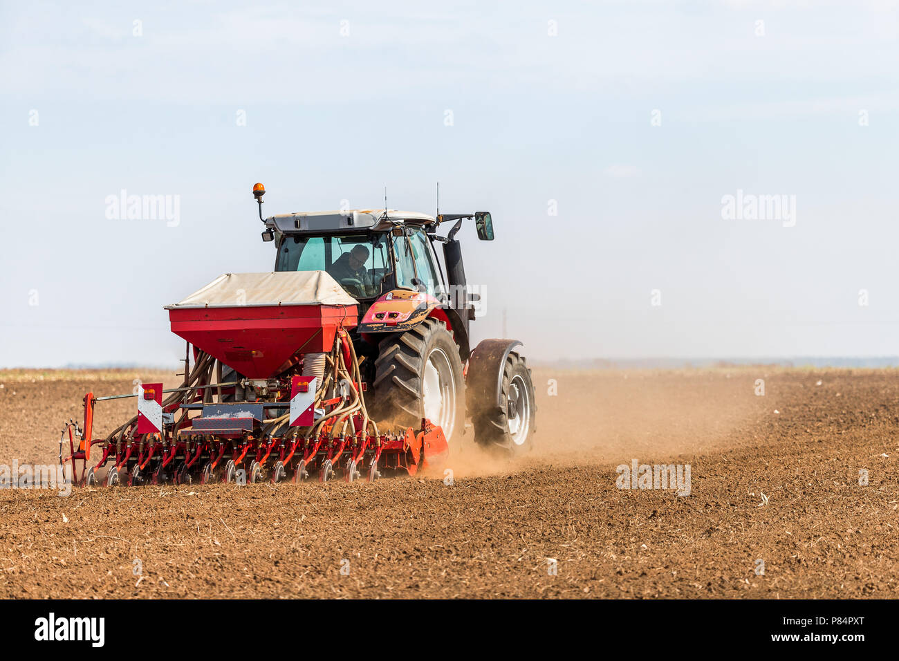 Farmer seeding, sowing crops at field. Sowing is the process of ...